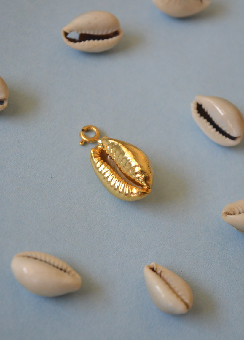 Cowrie Shell Charm - Gold – Tangerine Bio Jewelry